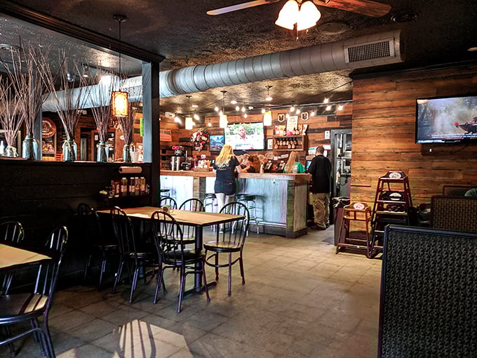 Rustic wooden walls and exposed ductwork create that perfect "discovered gem" atmosphere where memories are made between bites of smoky perfection.