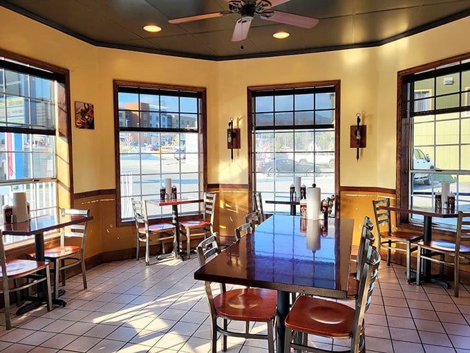 Sunlight streams through windows illuminating simple, clean dining spaces where the only decoration needed is the aroma of slow-smoked meats filling the air.