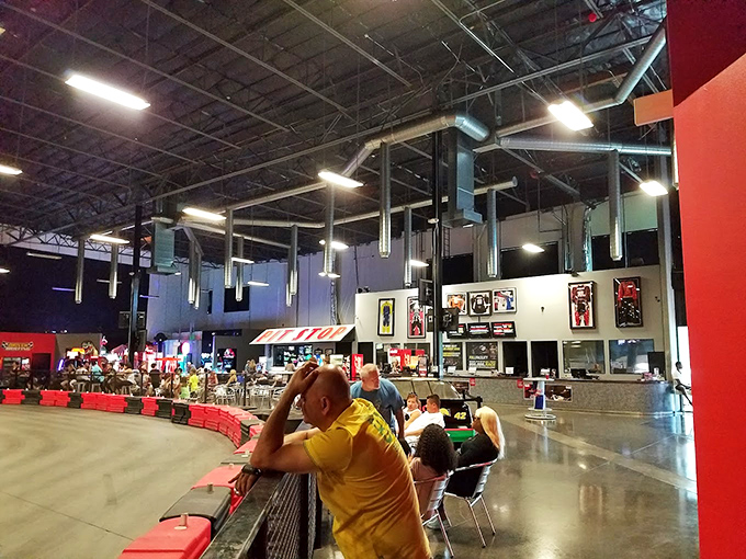 Racing fans line the barriers, living vicariously through every tight turn and near-miss. That guy in yellow is all of us&mdash;completely invested in someone else's lap time.