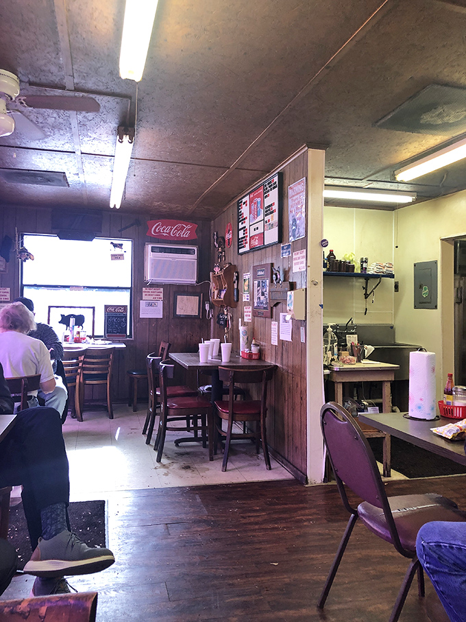 Inside, wood-paneled walls and simple furnishings tell you everything: this place prioritizes what's on your plate, not what's on their walls.