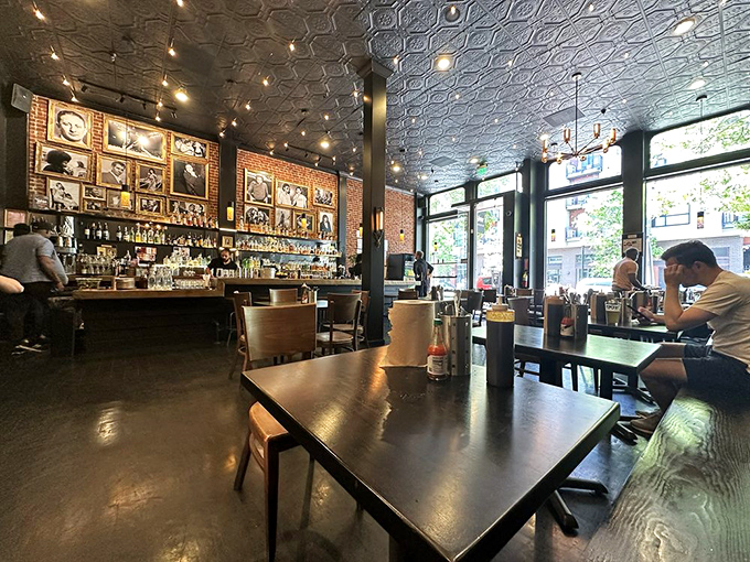 Inside, the pressed tin ceiling and exposed brick create a space that honors tradition while feeling distinctly Oakland &ndash; industrial chic meets smoke shack.