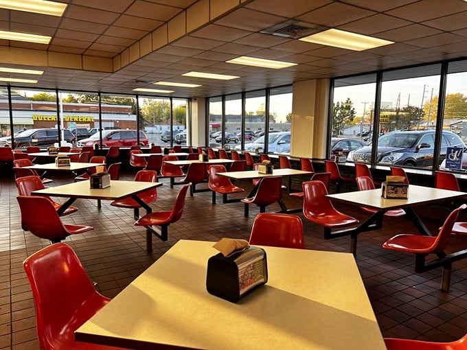 Red chairs, formica tables, and floor-to-ceiling windows create the perfect time capsule where conversations flow as freely as the malts.