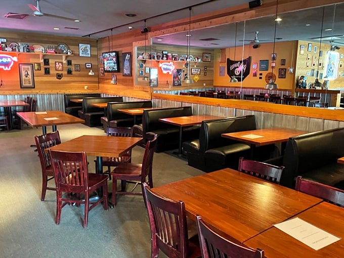 No white tablecloths here, just honest wooden tables, comfortable booths, and walls that tell stories of barbecue pilgrimages past.