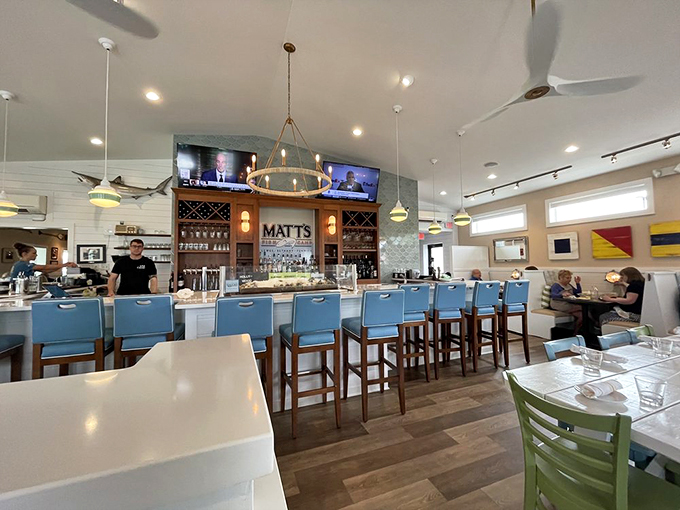 Coastal chic meets maritime comfort in this bright, airy interior where blue bar stools invite you to pull up a seat and stay awhile.