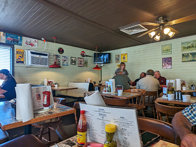Step inside and time slows down. The wood-paneled interior, vintage decor, and red pendant lights create that "where everybody knows your name" atmosphere we all crave. 
