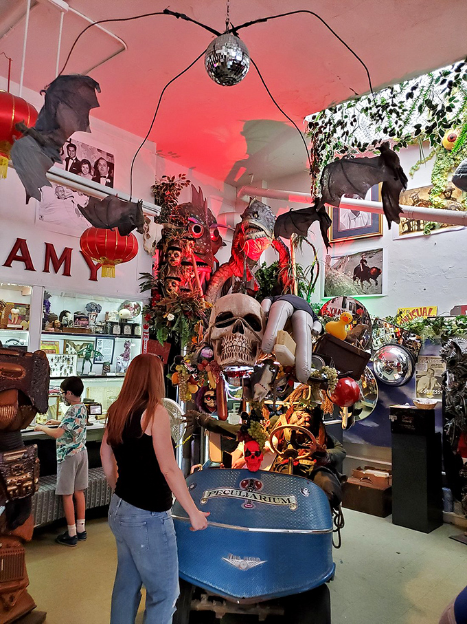 Where disco balls meet dangling bats and skulls become centerpieces. The Peculiarium's main room is sensory overload in the best possible way.