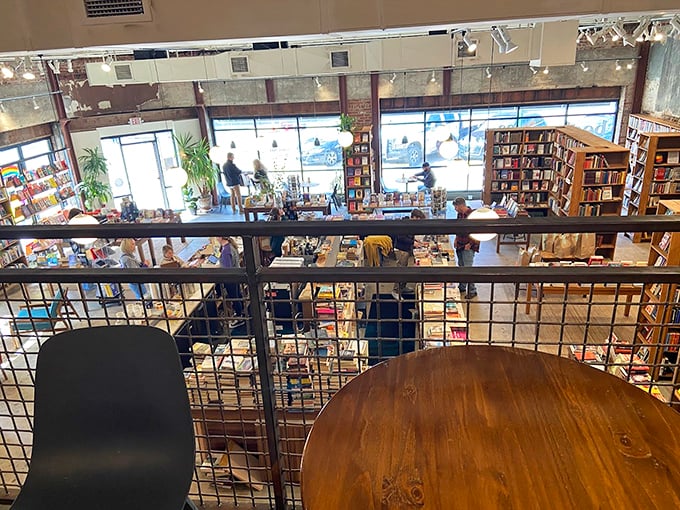 From the mezzanine, the entire literary ecosystem reveals itself&mdash;browsers hunting for treasures while sunlight streams through tall windows, illuminating endless possibilities.