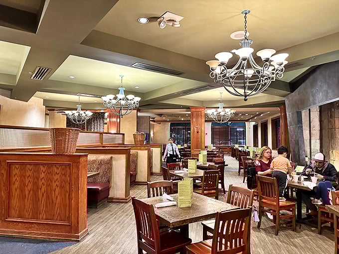 Elegant chandeliers and warm wood tones create an atmosphere that whispers, "Stay awhile, eat everything, regret nothing."