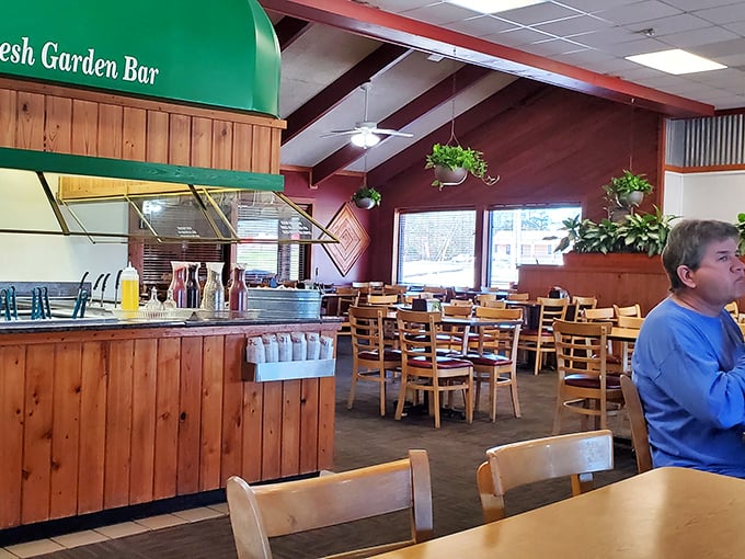 Wooden beams, hanging plants, and that unmistakable "Fresh Garden Bar" sign &ndash; the interior practically whispers, "Stay awhile, there's plenty more where that came from."