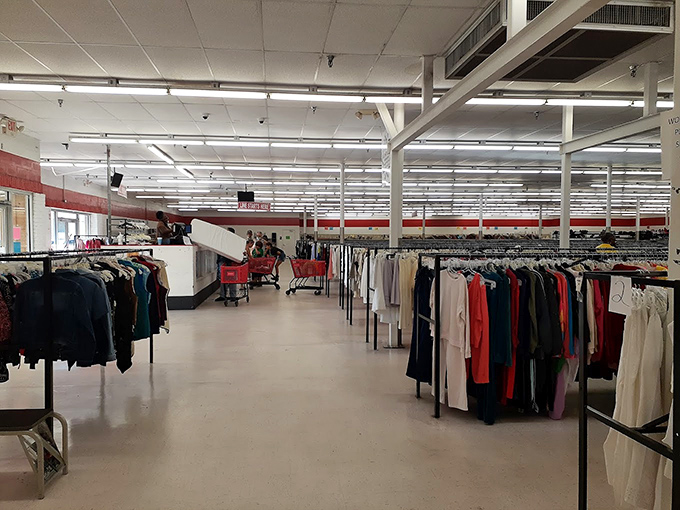 Endless racks of possibility stretch before you like a secondhand fashion runway, organized by color for the methodical bargain hunter.