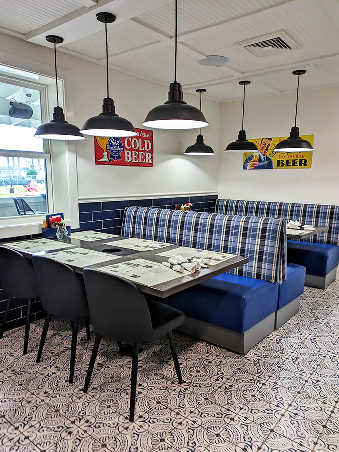 Blue booth seating, vintage beer signs, and pendant lighting create that perfect "come as you are" vibe where seafood dreams come true.