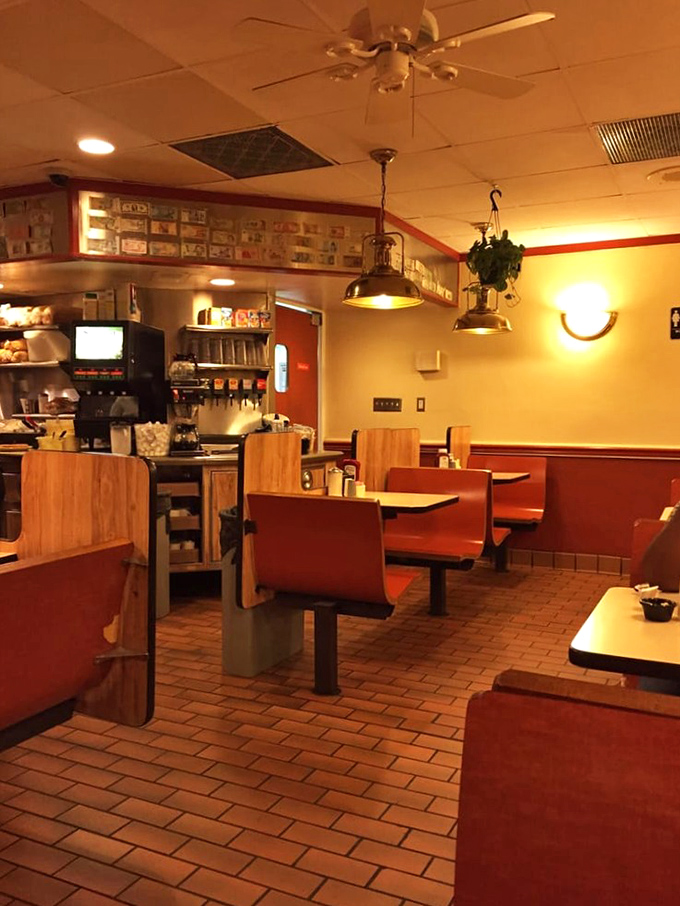 Inside, the warm glow of pendant lights illuminates cozy booths where countless conversations, first dates, and study sessions have unfolded over steaming plates.