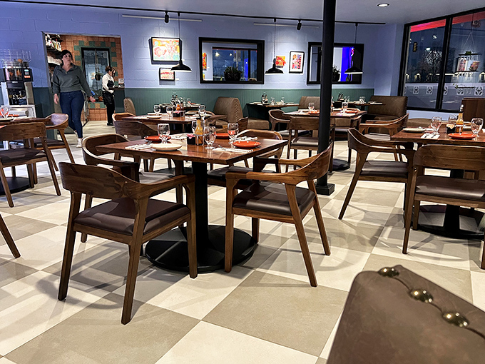 Mid-century modern meets morning comfort in Classen Grill's stylish dining room, where wooden chairs invite you to settle in for a leisurely feast.