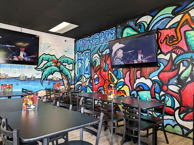 Vibrant graffiti-style murals transform this Kansas eatery into a coastal escape. The colorful walls tell you immediately: this isn't your average Midwest restaurant experience.