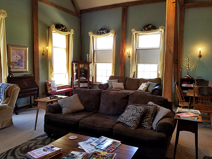Original timber beams frame this cozy sitting area, where magazines wait patiently for you to ignore your phone and rediscover the joy of page-turning.