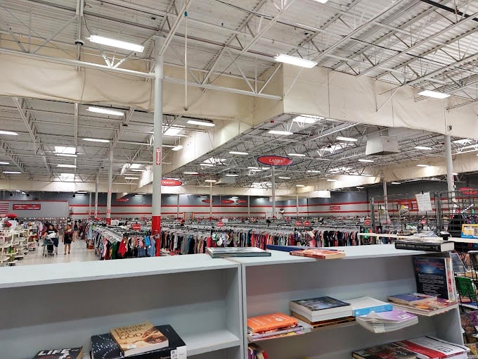 Racks upon racks stretching toward infinity under industrial lighting&mdash;this isn't just shopping, it's an expedition with fluorescent trail markers.