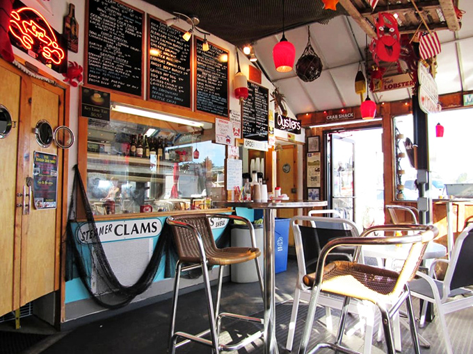 Step inside this maritime time capsule where every hanging buoy tells a story. The cozy interior feels like the galley of a beloved fishing vessel that decided to drop anchor permanently.