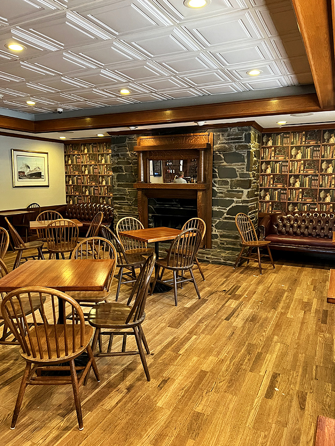 Library meets living room in this cozy dining space, where stone walls and wooden furniture create the perfect backdrop for intimate conversations and comfort food revelations.