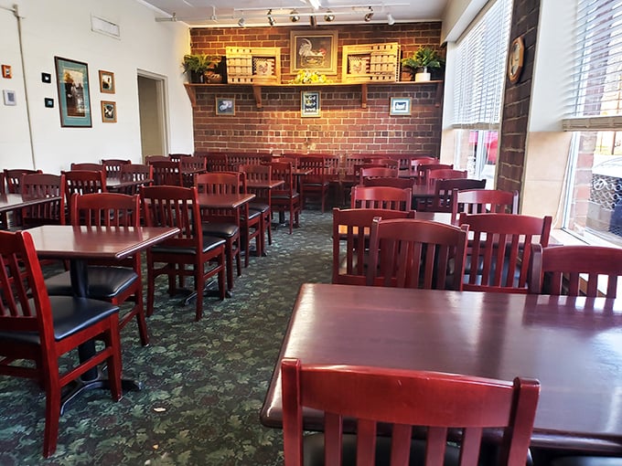 Simple wooden chairs and tables create a no-frills dining room where the only decoration needed is the aroma of perfectly fried chicken wafting through the air.