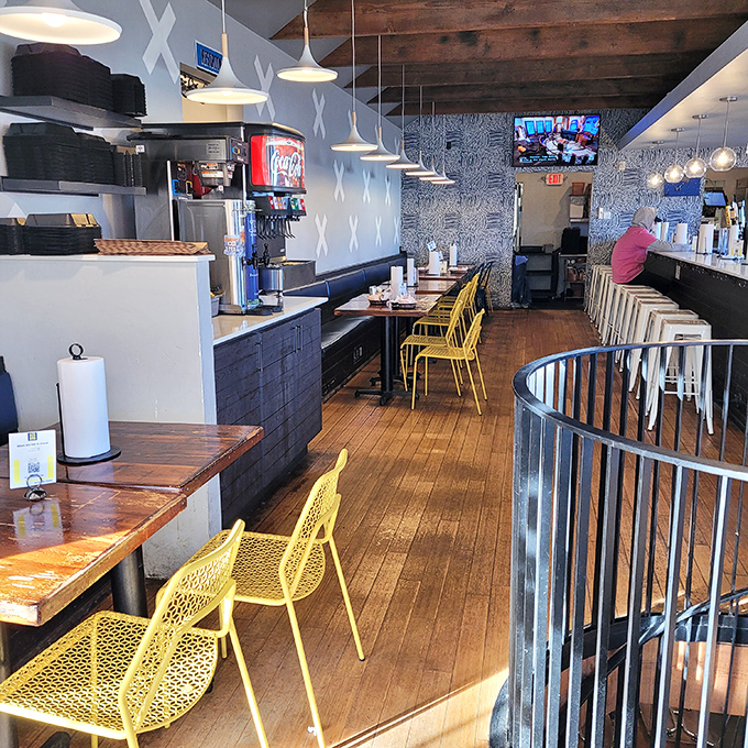 Inside, modern meets homey with those eye-catching yellow chairs and warm wood tones. The kind of place where calories don't count and conversations flow.