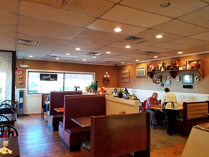 Classic diner aesthetics with wooden booths worn smooth from decades of satisfied customers. The kind of place where comfort begins before the food arrives.
