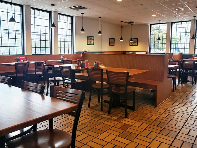 Cozy wooden booths bathed in natural light create the perfect backdrop for morning conversations and maple syrup-induced happiness.