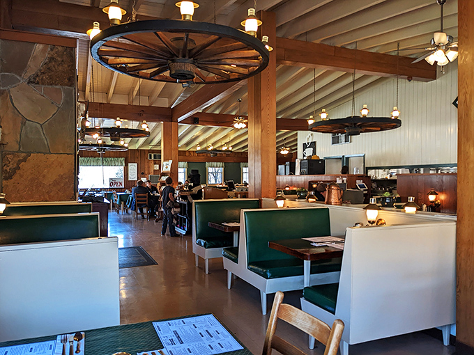 Wagon wheel chandeliers and wood-paneled walls create that perfect mountain lodge vibe. It's like breakfast in your cool uncle's cabin – if your uncle could cook like this.