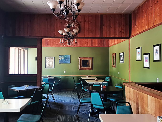 Warm wooden paneling meets mint green walls, creating a dining room that feels like your coolest aunt's kitchen circa 1978. 