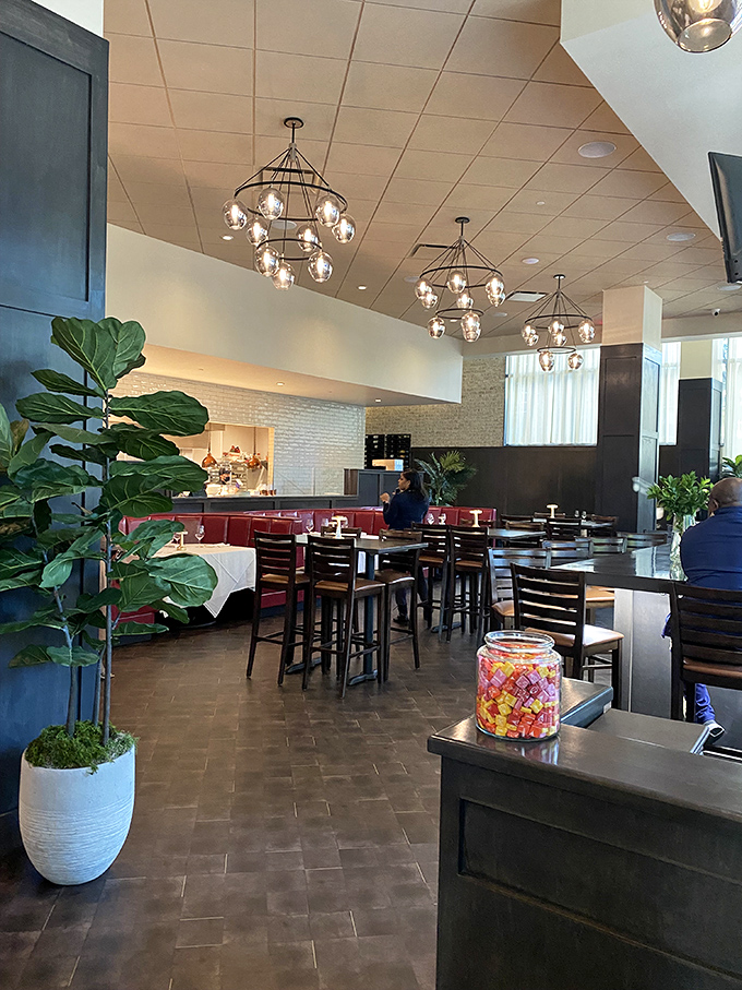 Step inside and discover modern elegance meets Southern comfort. Those globe chandeliers cast the kind of glow that makes everyone look like they just returned from vacation.