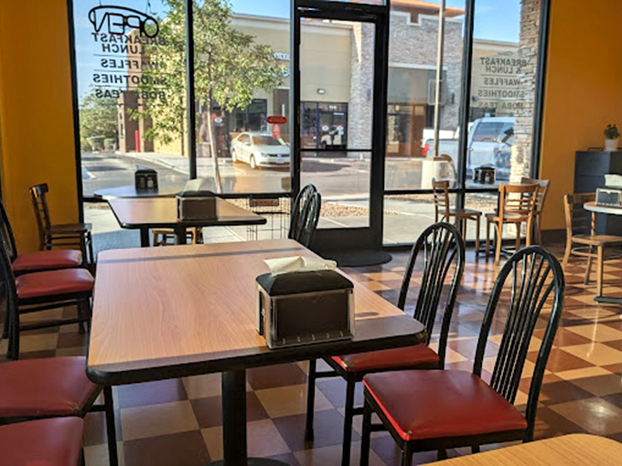 Inside, the checkered floor and warm yellow walls create a retro diner vibe where calories don't count and breakfast is always the right answer.