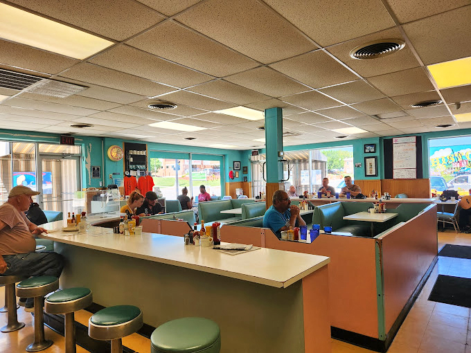 The mint-green columns and classic diner booths aren't trying to impress Instagram &ndash; they're too busy creating the perfect backdrop for genuine Nebraska conversations.