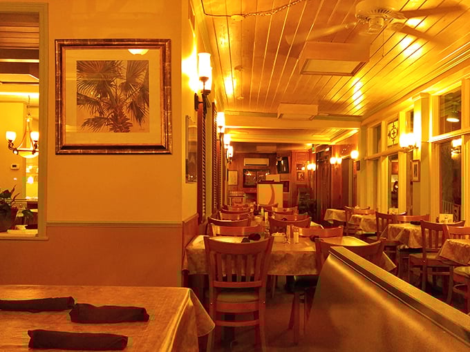 Warm amber lighting bathes wooden tables in a glow that whispers, "Stay awhile, loosen that belt." The dining room feels like Thanksgiving at your favorite relative's house.