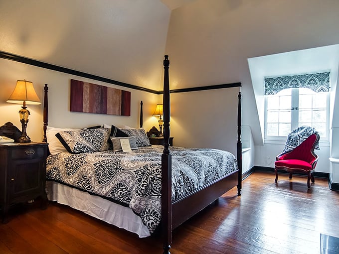Sunshine streams through windows in this cheerful yellow room, where the four-poster bed and fireplace promise the kind of comfort Netflix can't provide. 