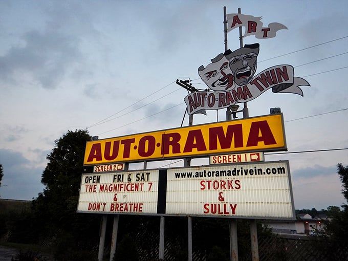 The iconic Aut-O-Rama sign stands as a neon beacon of nostalgia, announcing tonight's double features with theatrical flair.