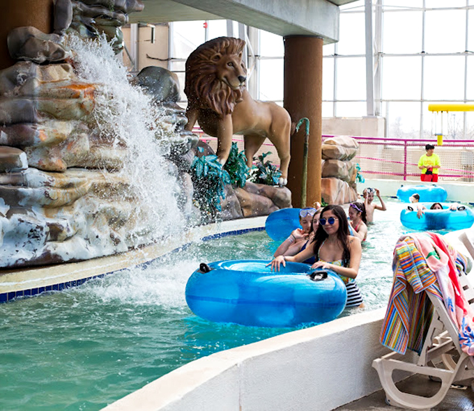 Where Oklahoma meets the Serengeti. That majestic lion keeps watch over lazy river adventurers, probably thinking, "These humans have the right idea about relaxation."