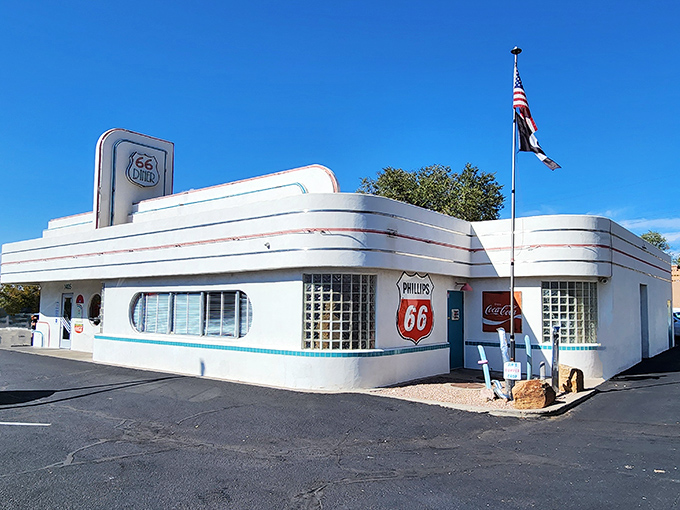 The 66 Diner's gleaming white streamlined design looks like it drove straight out of American Graffiti and parked on Route 66.
