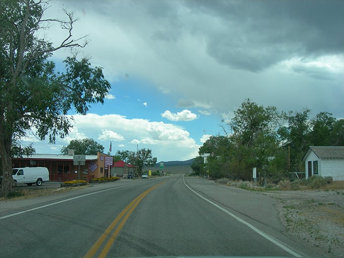 Baker's wide-open road leads to nowhere and everywhere at once, with storm clouds brewing drama over this gateway to Great Basin National Park.