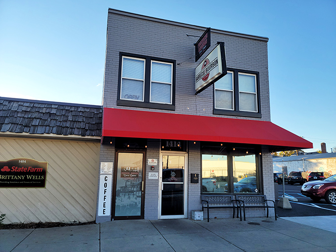 That bright red awning is like a beacon for BBQ lovers. Simple storefront, extraordinary flavors waiting inside.