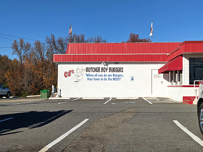 CJ's bold red-and-white declaration: "When all you do are burgers, they have to be the BEST." Truer words were never painted on cinder block.
