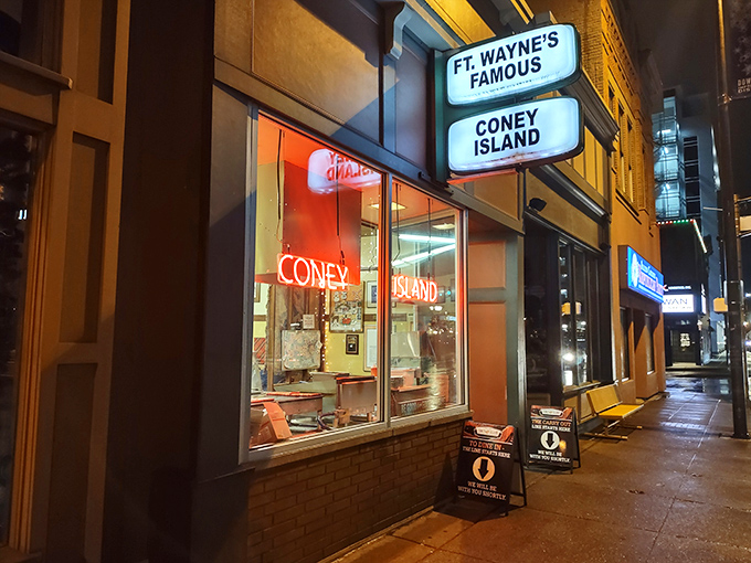 Fort Wayne's famous Coney Island glows like a neon-lit beacon for hot dog lovers after dark. Some traditions are worth preserving.