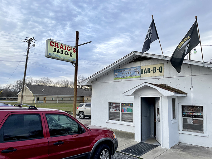 Craig's Bar-B-Q proudly flies its flags high. This tiny white building has been a barbecue landmark for generations.