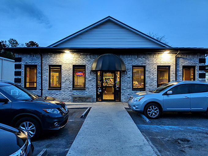 Early Bird Diner's colorful brick facade glows at dusk &ndash; where breakfast dreams come true even after the sun goes down.