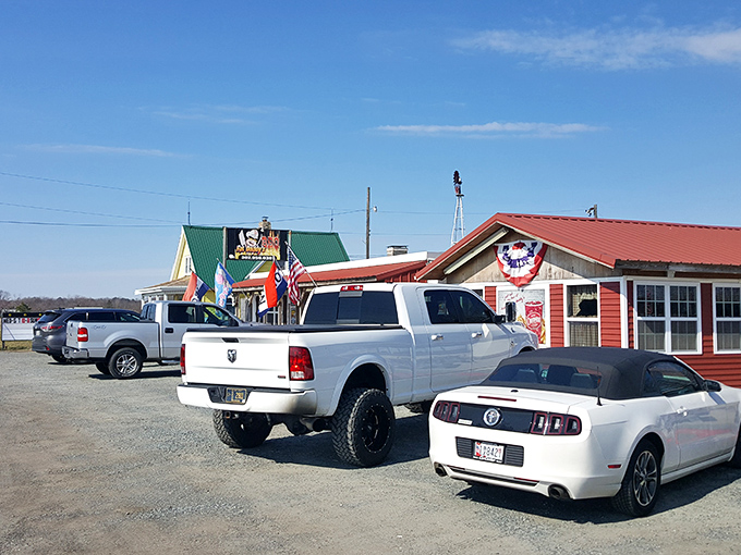 Fat Daddy's BBQ (Georgetown): Red building, American flag, and trucks in the parking lot&mdash;the universal language of "serious barbecue happens here."