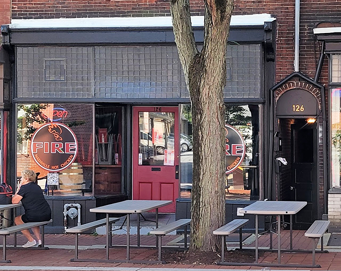 Fire Nashville Hot Chicken (West Chester): "Red neon that beckons like a lighthouse for spice seekers. The glow promises heat that'll warm you from the inside out."