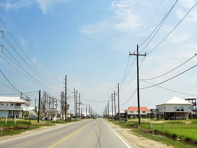 Grand Isle's coastal highway stretches into the distance, where stilted homes stand ready to face whatever Mother Nature brings.