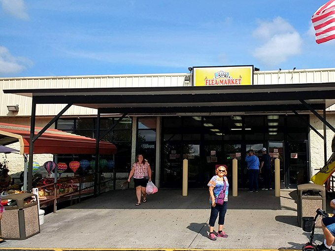 The entrance beckons with promises of bargains beyond the automatic doors. Resistance is futile!