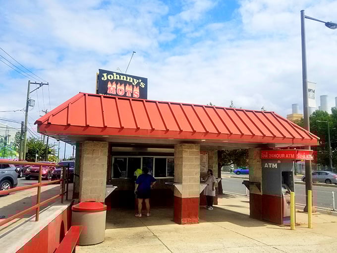 Johnny's Hots stands like a hot dog sentinel under that unmistakable red roof. Philadelphia's answer to fast food royalty! 