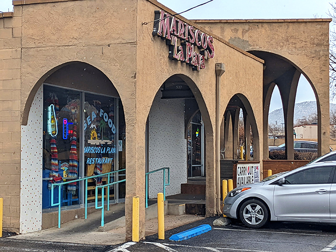 Mariscos La Playa's inviting arches welcome seafood lovers like a portal to coastal Mexico. A stucco sanctuary of shrimp and satisfaction!