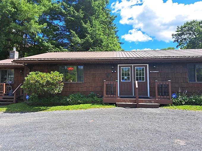 Melanie's wooden cabin exterior promises the kind of honest cooking that doesn't need fancy architecture to impress—just plates that come back empty.