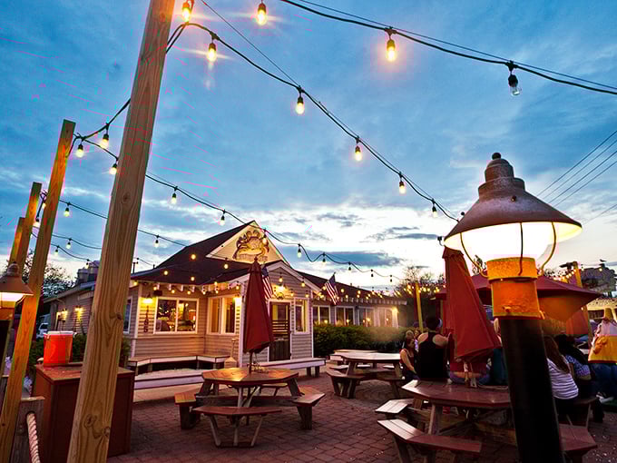 Mud City Crab House: String lights transform simple picnic tables into the kind of magical spot where seafood memories are made.